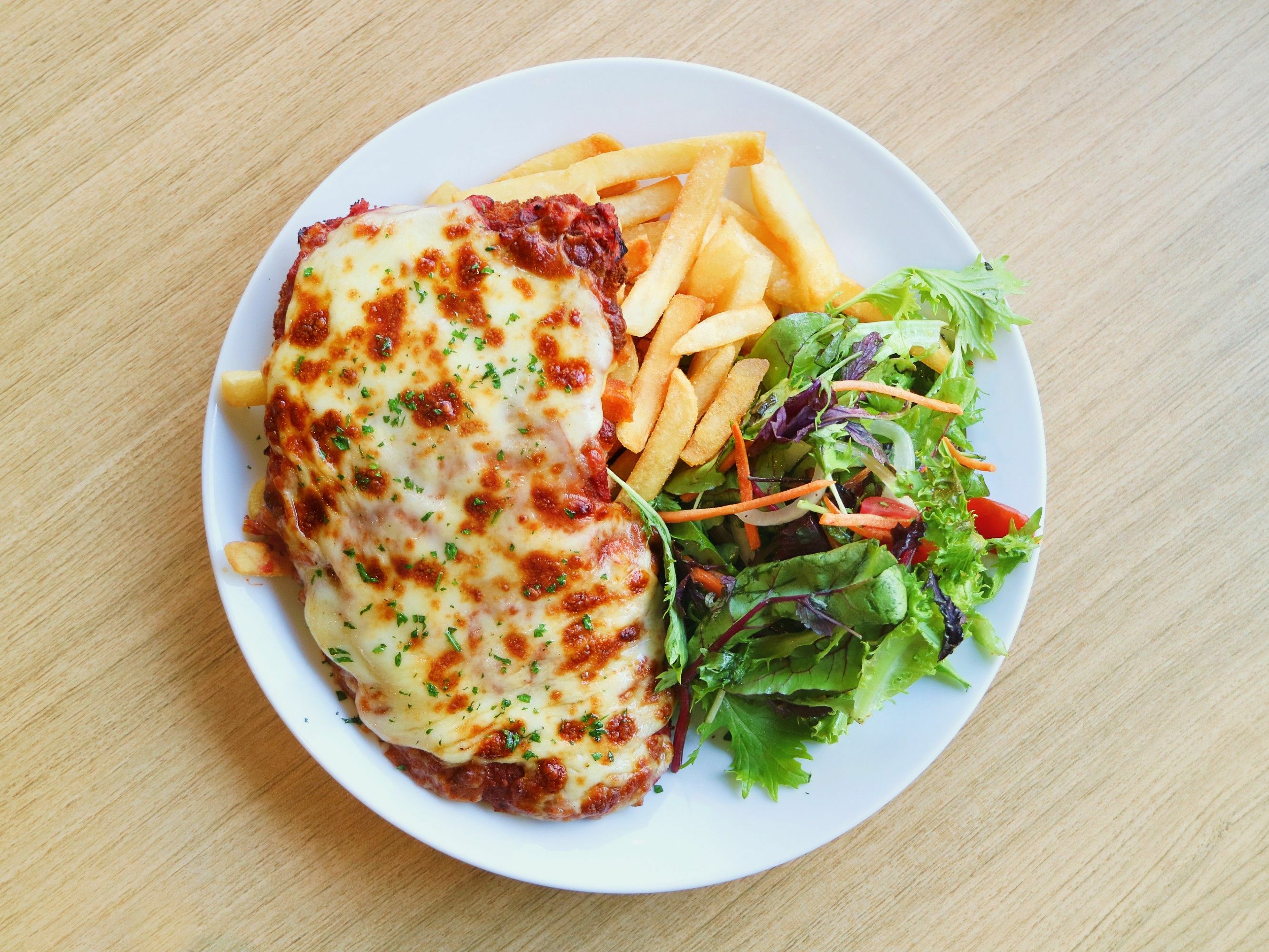 Tuck into a chicken parma to help Aussie farmers